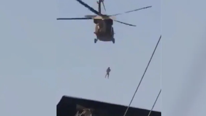 Its not dead body man dangling from helicopter in Kandahar viral video ...