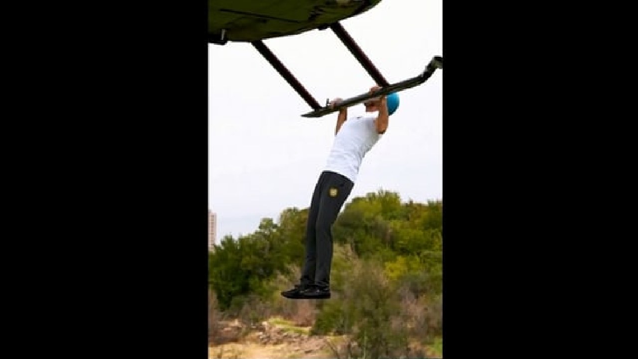 Viral Video Man does pull ups while hanging from a helicopter to create ...